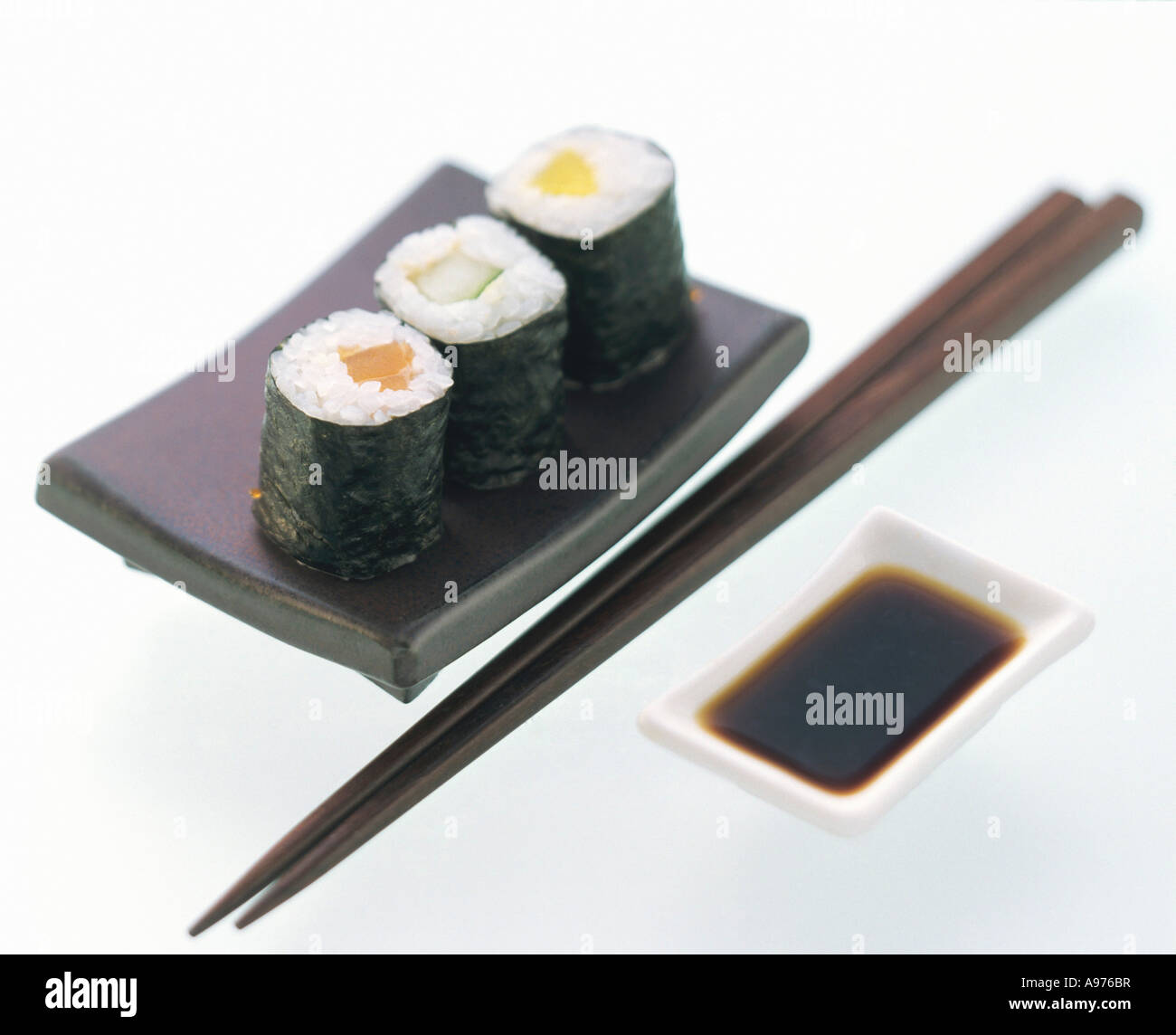 Assorted Maki Sushi with Chopsticks and Dipping Sauce FoodCollection ...