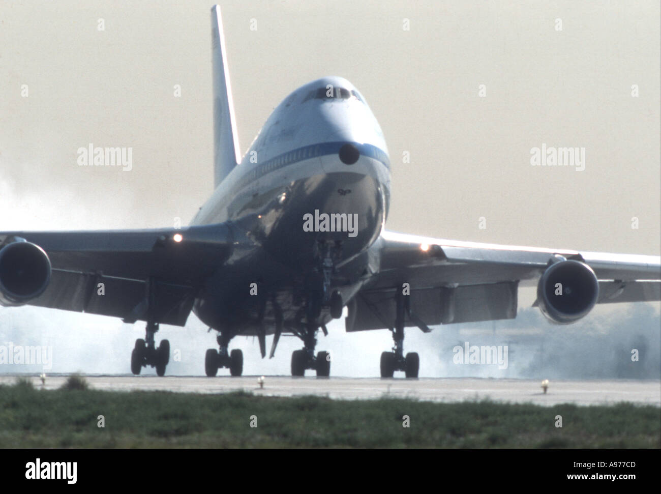 Boeing 747 commercial jet landing at international airport Stock Photo ...