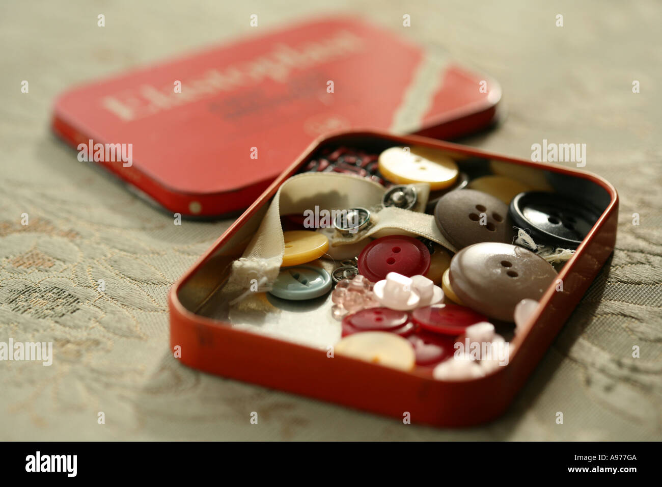 close-up of tin of buttons Stock Photo - Alamy