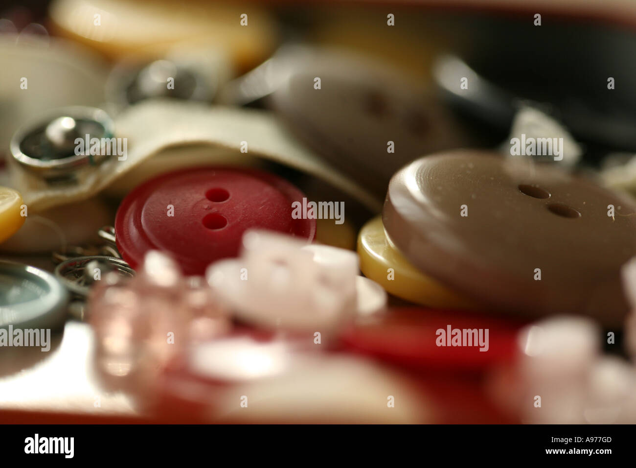 Tin buttons hi-res stock photography and images - Alamy