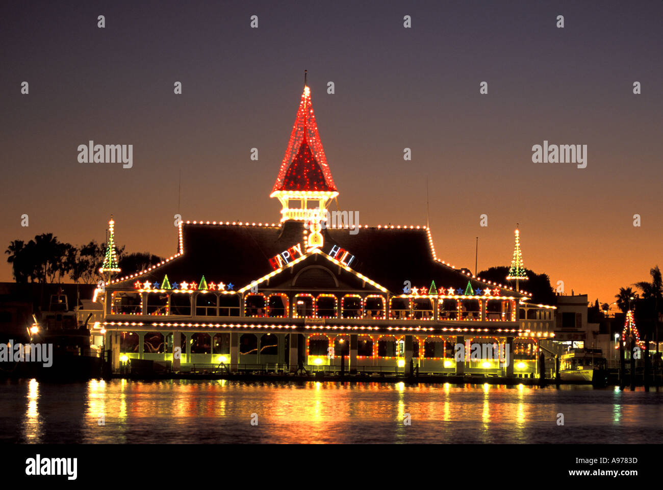 Balboa Pavilion and Peninsula Fun Zone across Newport Harbor as viewed ...