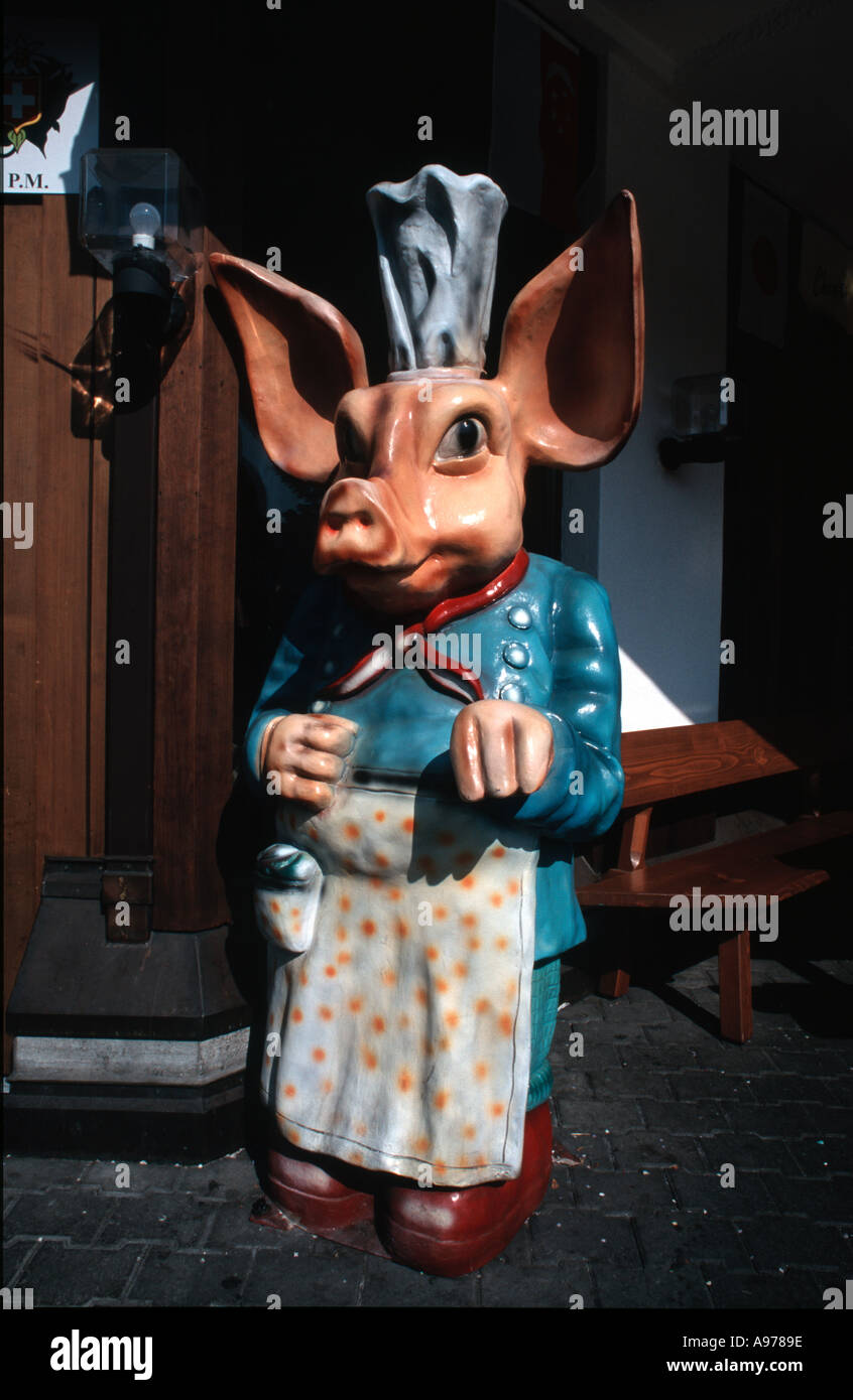 Model of a pig outside a restaurant in Switzerland Stock Photo - Alamy