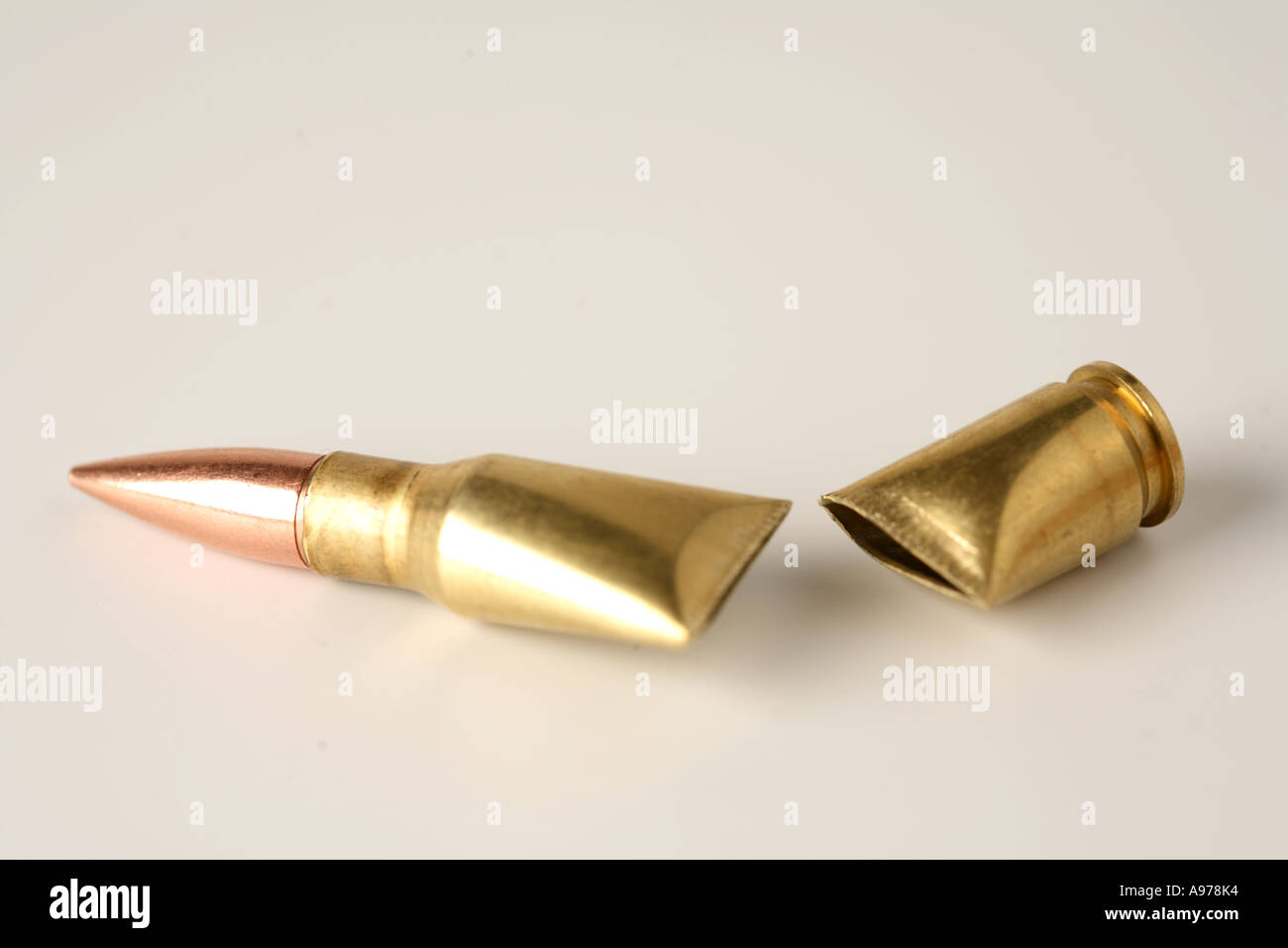 a rifle bullet cut in half peace an end to war Stock Photo - Alamy