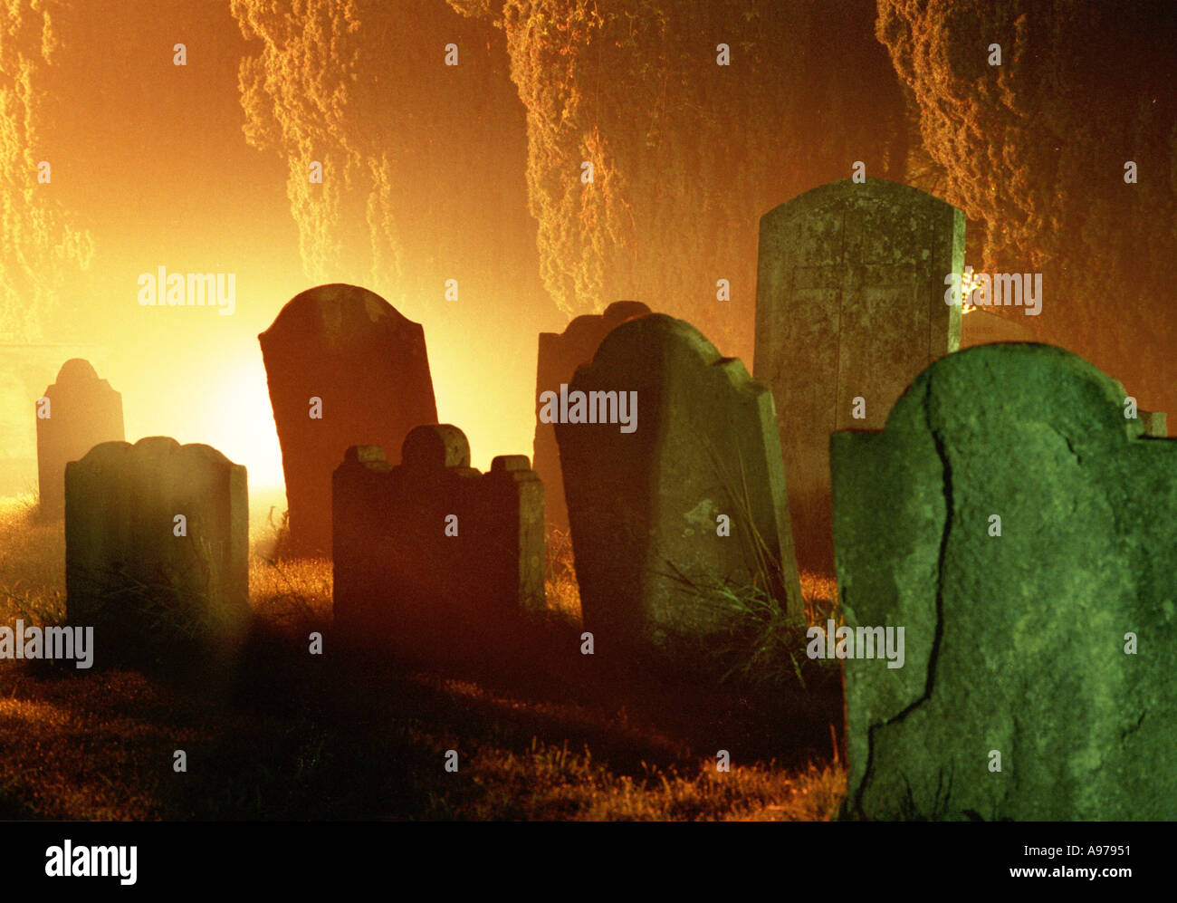A graveyard by night Stock Photo - Alamy
