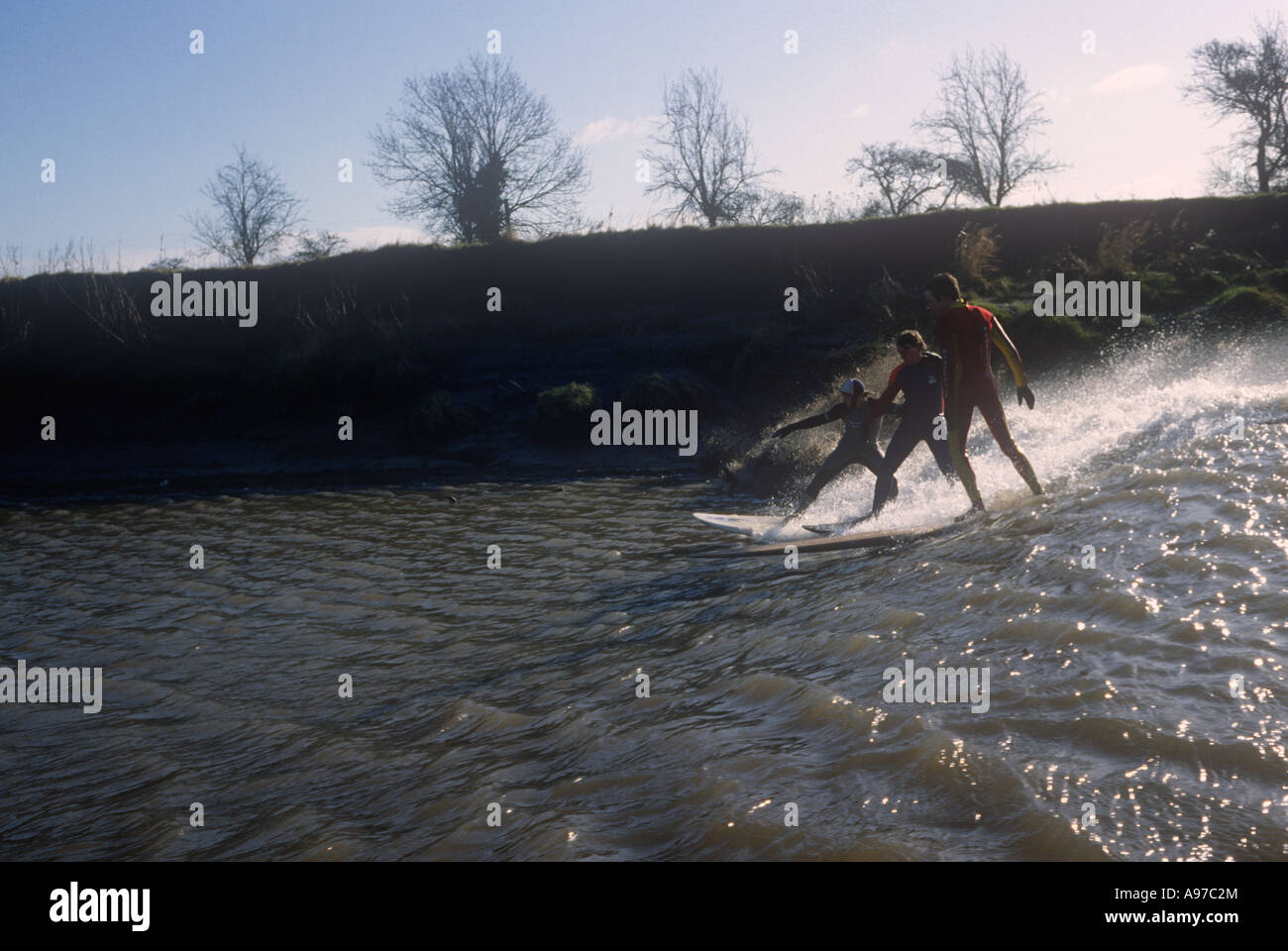 Surfers Riding the Severn Bore Wave River Severn South East Wales Stock ...
