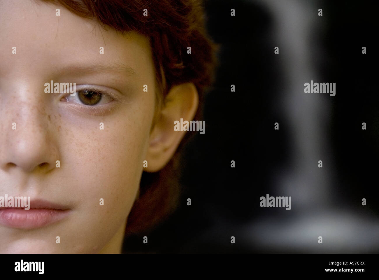 Portrait of Red headed boy showing only half his face Stock Photo - Alamy