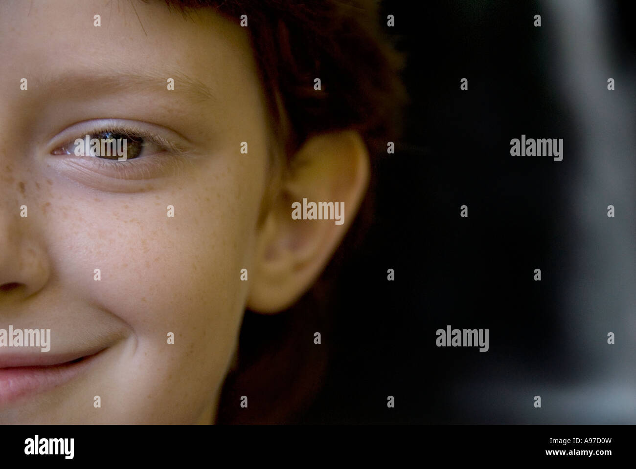 Portrait Red headed boy showing only half his face Stock Photo - Alamy