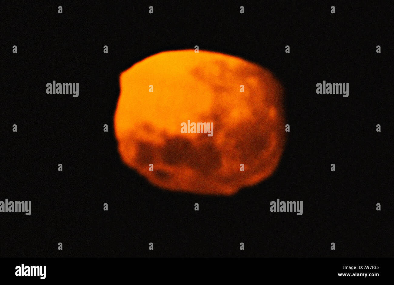 Moon distorted by haze Namibia Stock Photo - Alamy