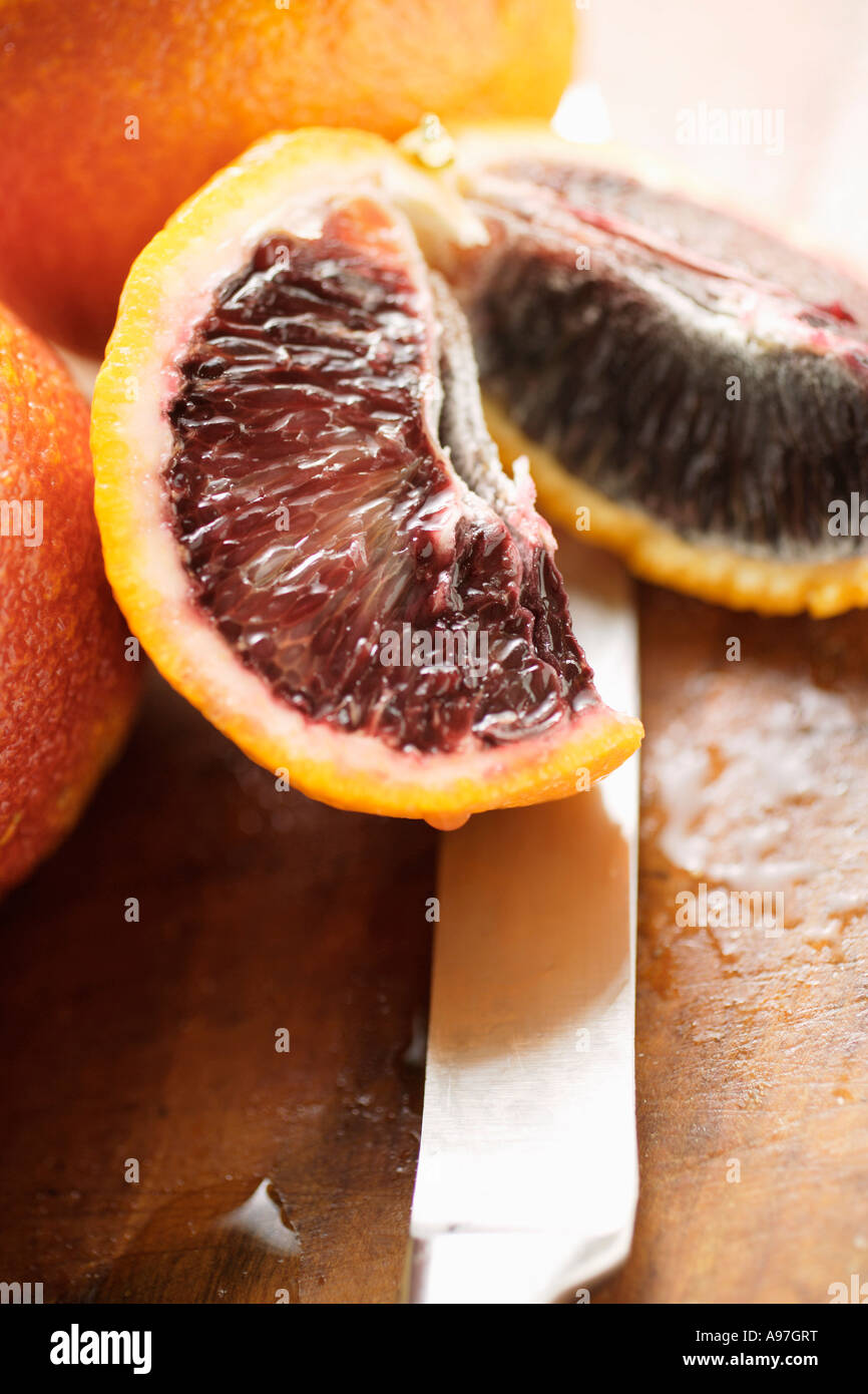 Wedges of blood orange on knife FoodCollection Stock Photo - Alamy