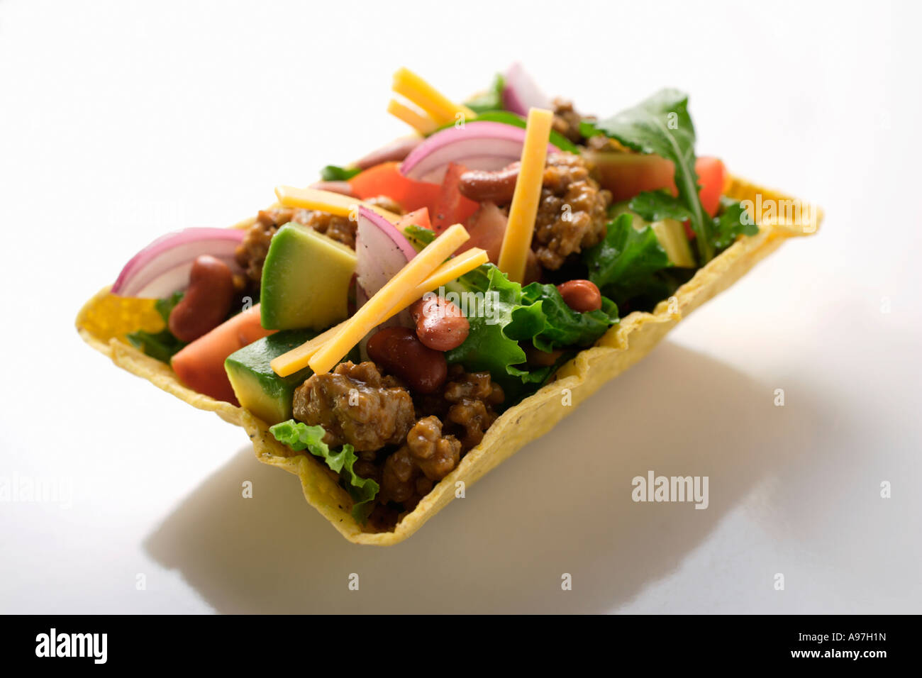 Salad with mince vegetables cheese in taco shell Mexico FoodCollection ...