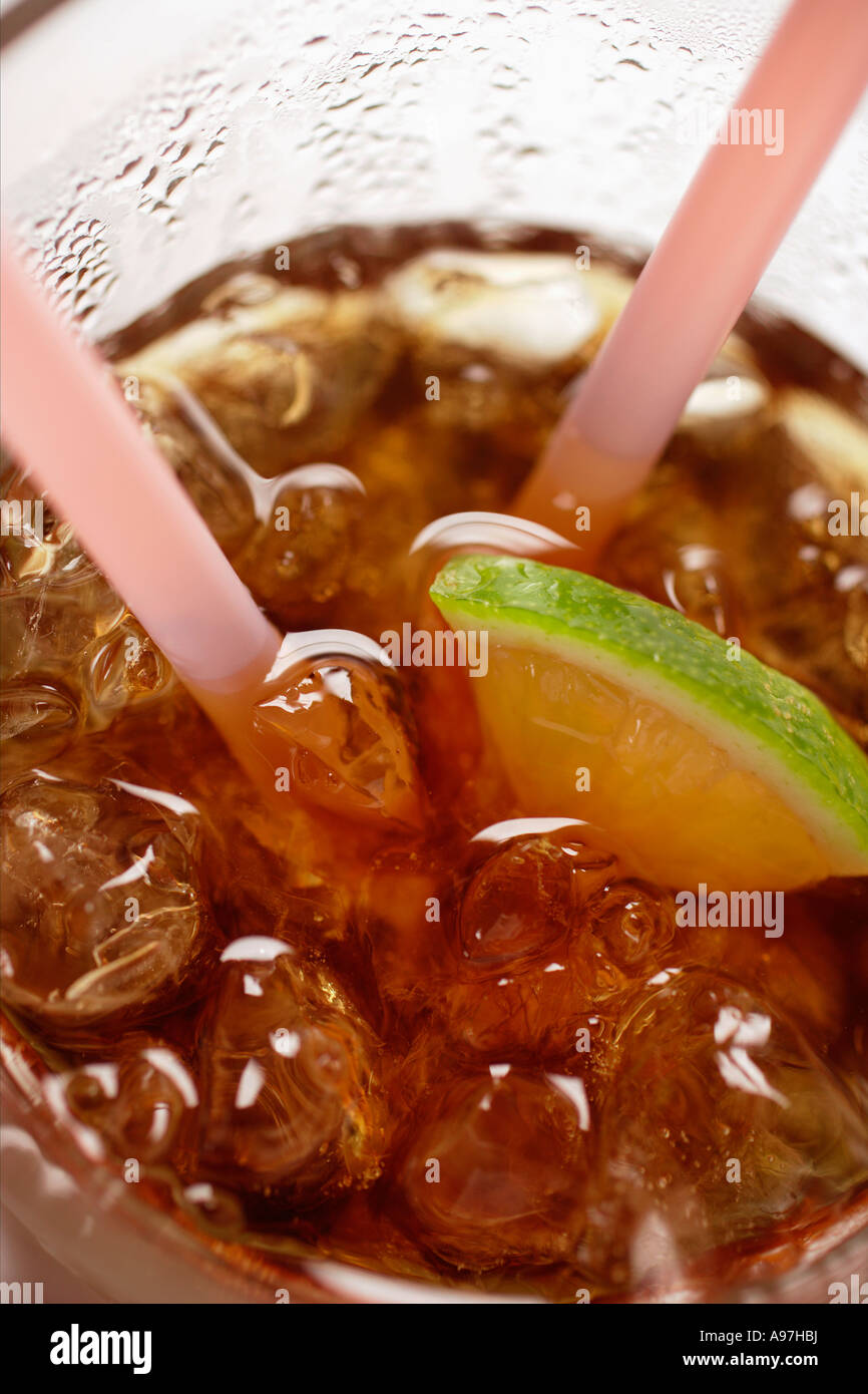 Cola with ice cubes and lemon close up FoodCollection Stock Photo - Alamy