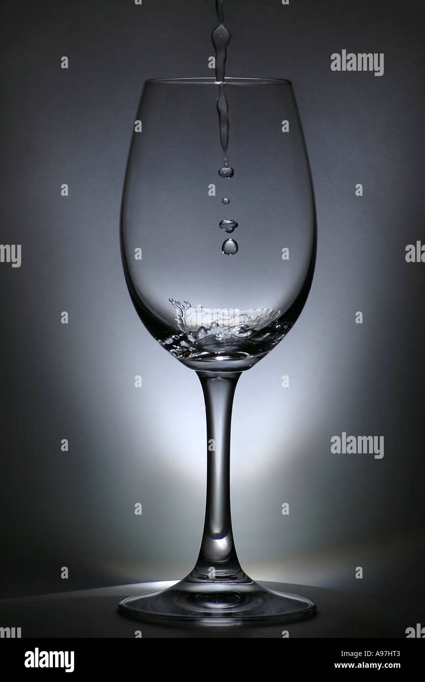 Water falling in crystal glass Stock Photo - Alamy