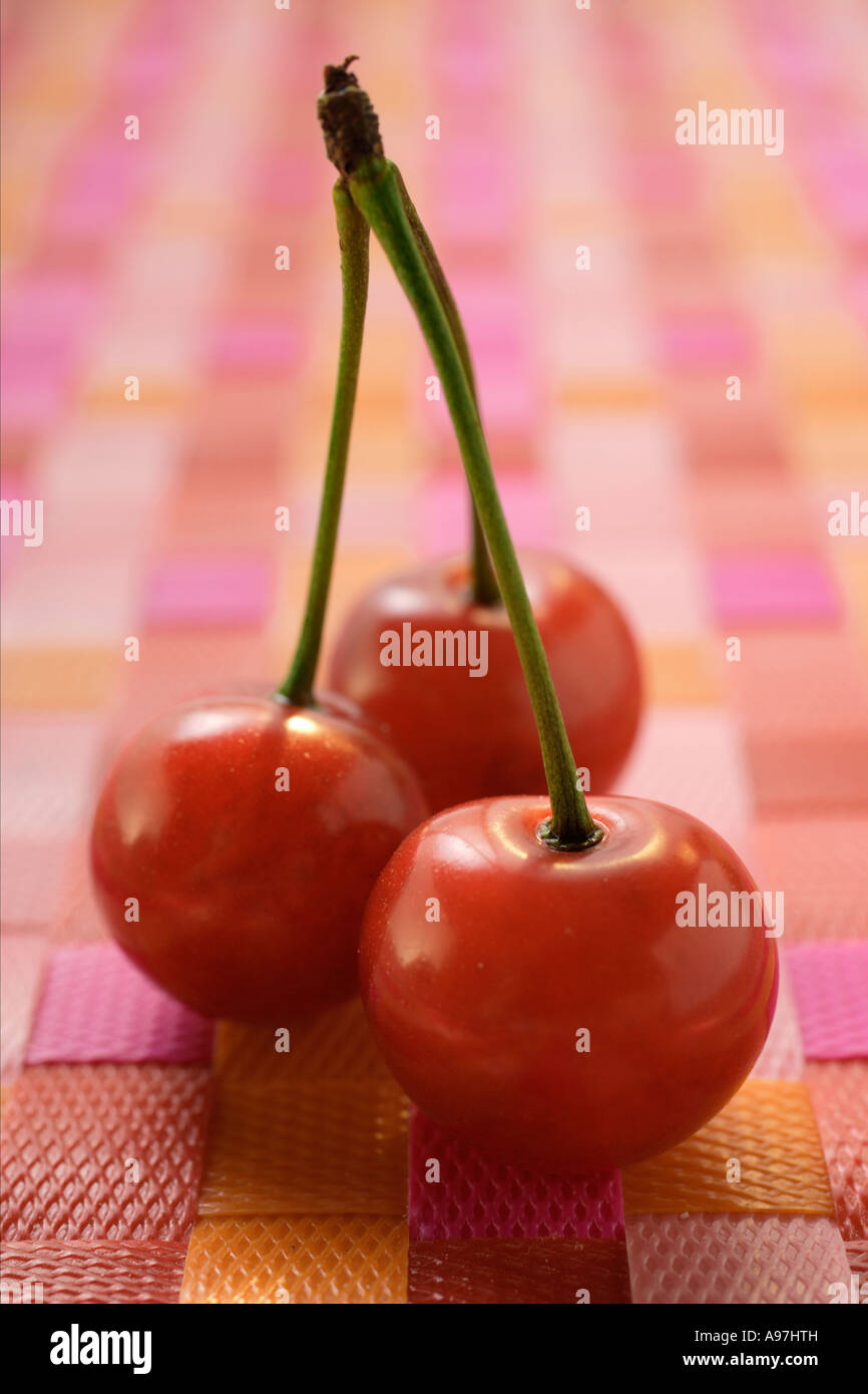Three fresh cherries on stalk FoodCollection Stock Photo - Alamy
