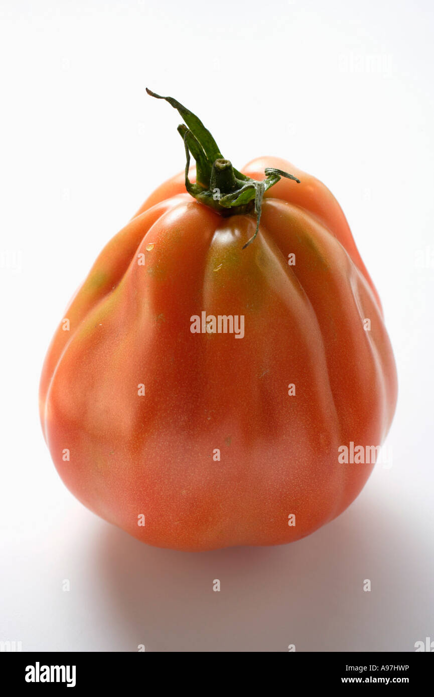 A tomato standing on its end FoodCollection Stock Photo - Alamy