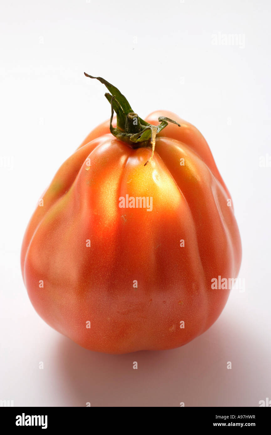 A tomato standing on its end FoodCollection Stock Photo - Alamy