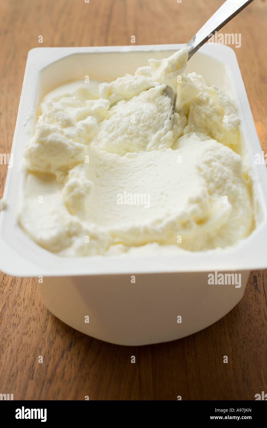 Quark in opened packaging with spoon FoodCollection Stock Photo - Alamy