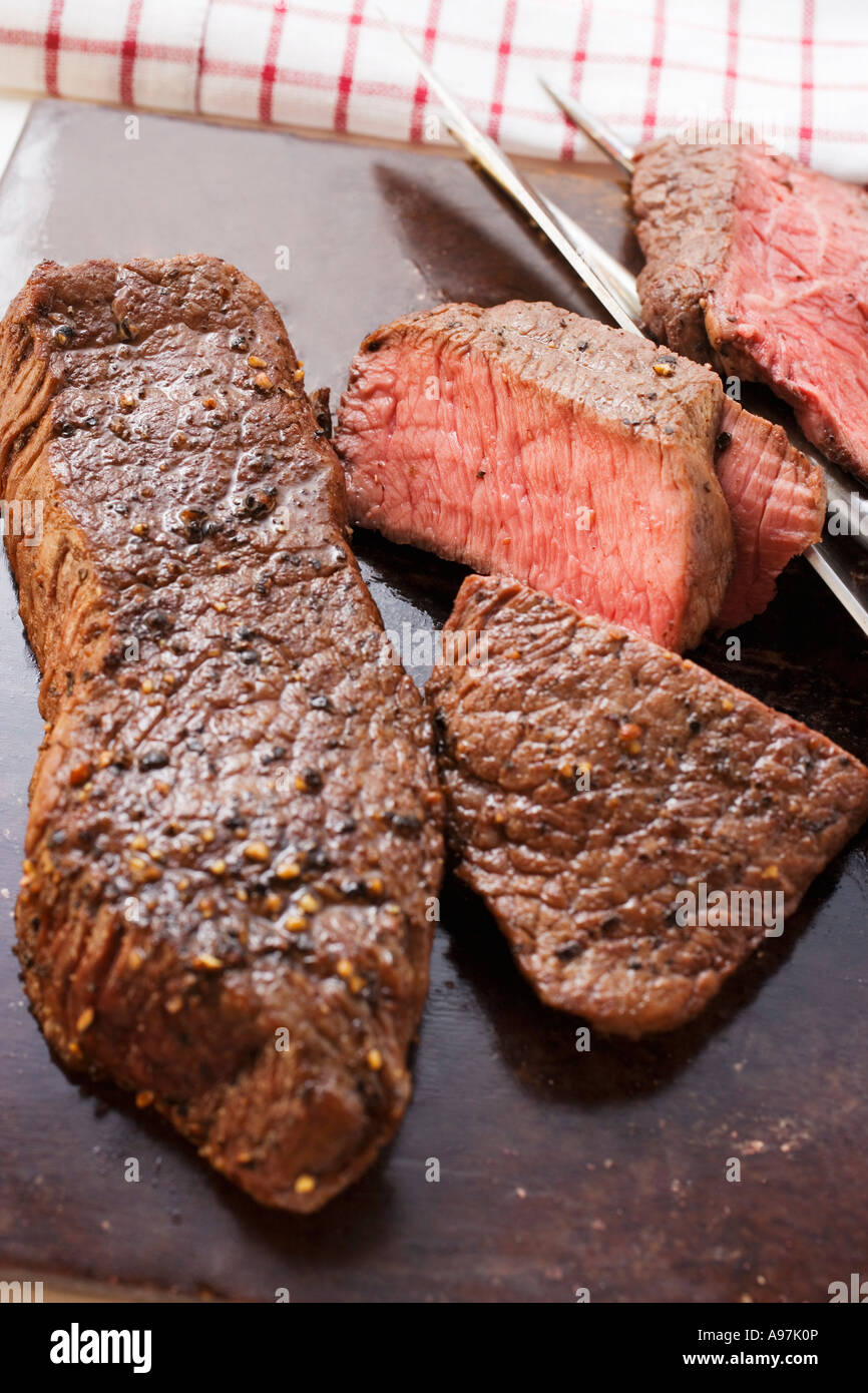 Two beef steaks one sliced FoodCollection Stock Photo - Alamy