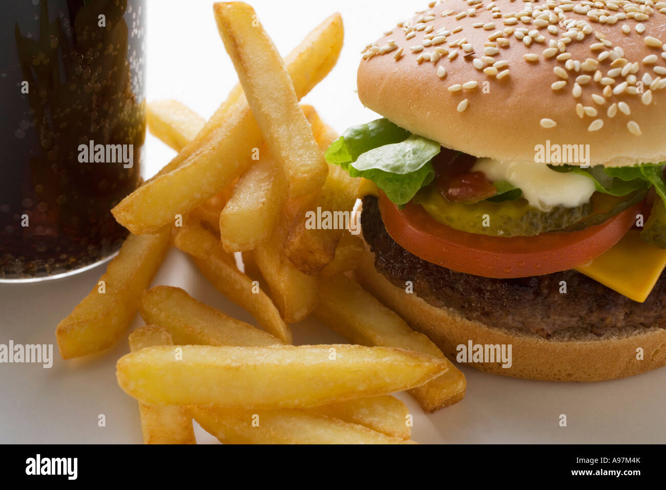 Cheeseburger with chips and Cola FoodCollection Stock Photo - Alamy