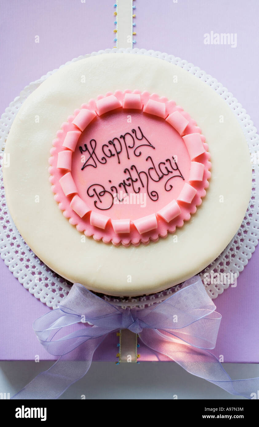 Birthday cake on pale purple box FoodCollection Stock Photo - Alamy