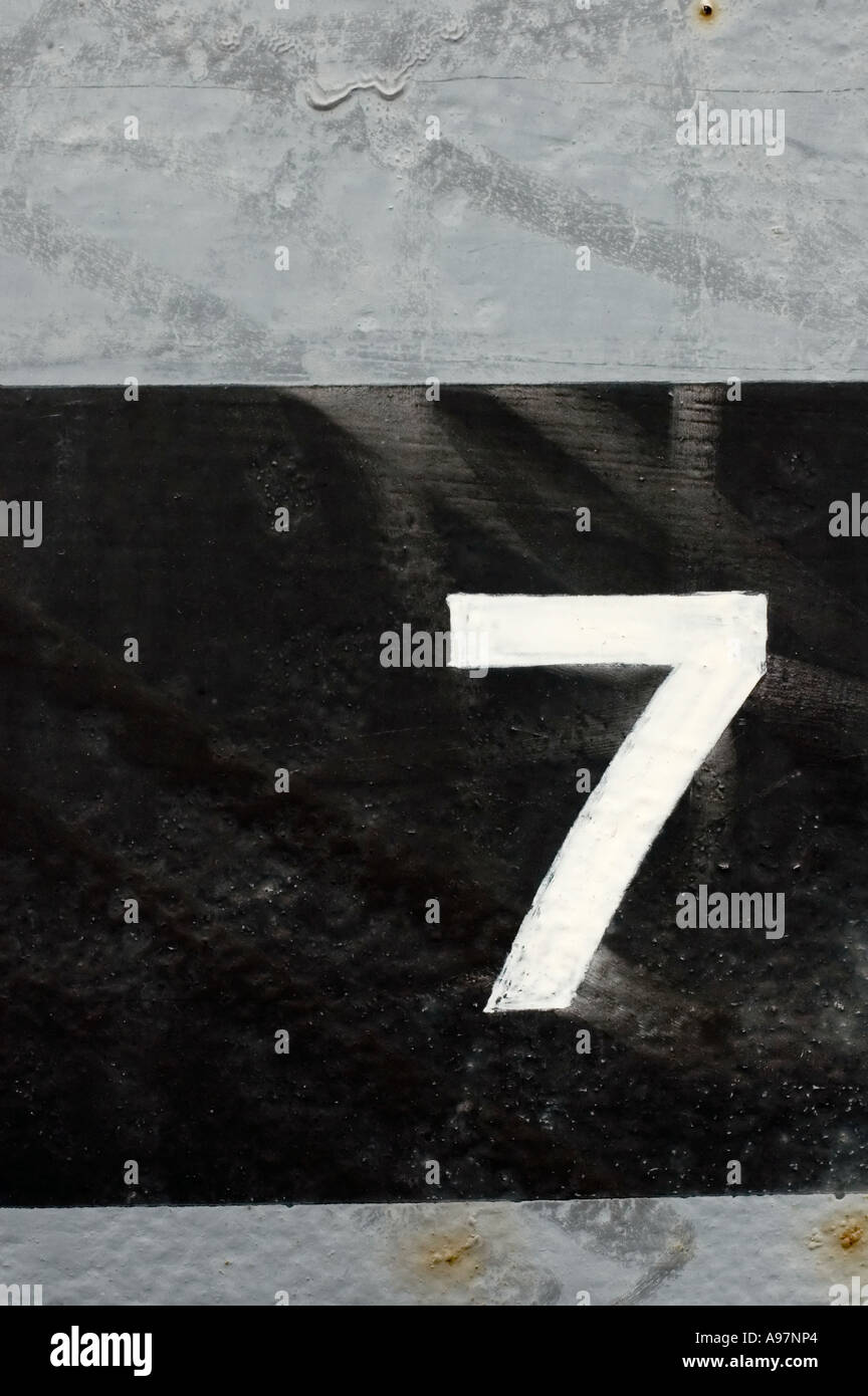 White number seven (7) against a black background Stock Photo - Alamy
