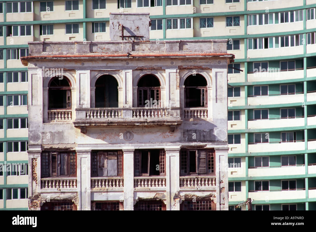 Colonial style building in front of a modern tower block on the Malecon ...