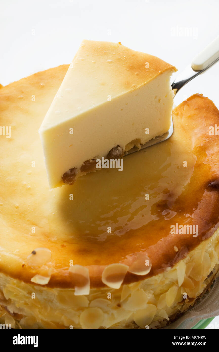 Cheesecake a piece cut with piece on server FoodCollection Stock Photo ...