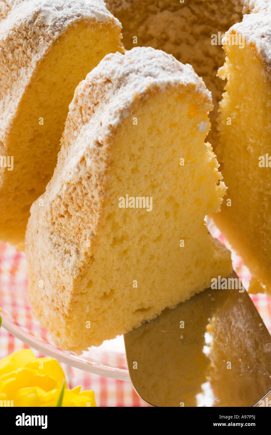 Ring cake with icing sugar pieces cut FoodCollection Stock Photo - Alamy