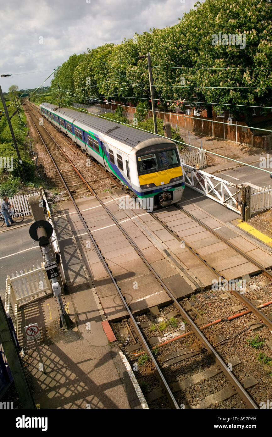 train passing over a road at a manned rail crossing Stock Photo - Alamy