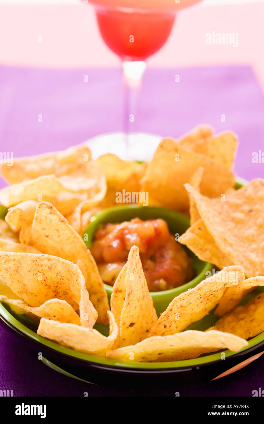 Tortilla chips and salsa in a bowl FoodCollection Stock Photo - Alamy