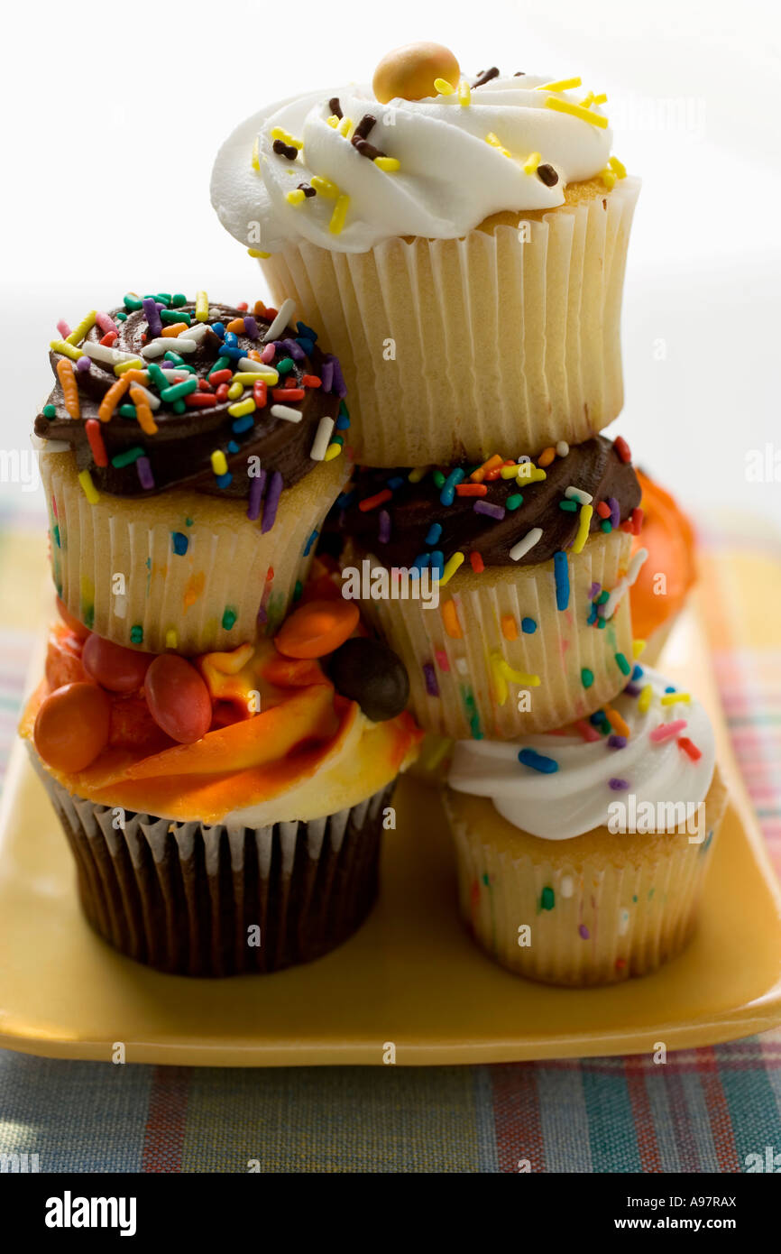 A pile of colourful decorated muffins FoodCollection Stock Photo - Alamy
