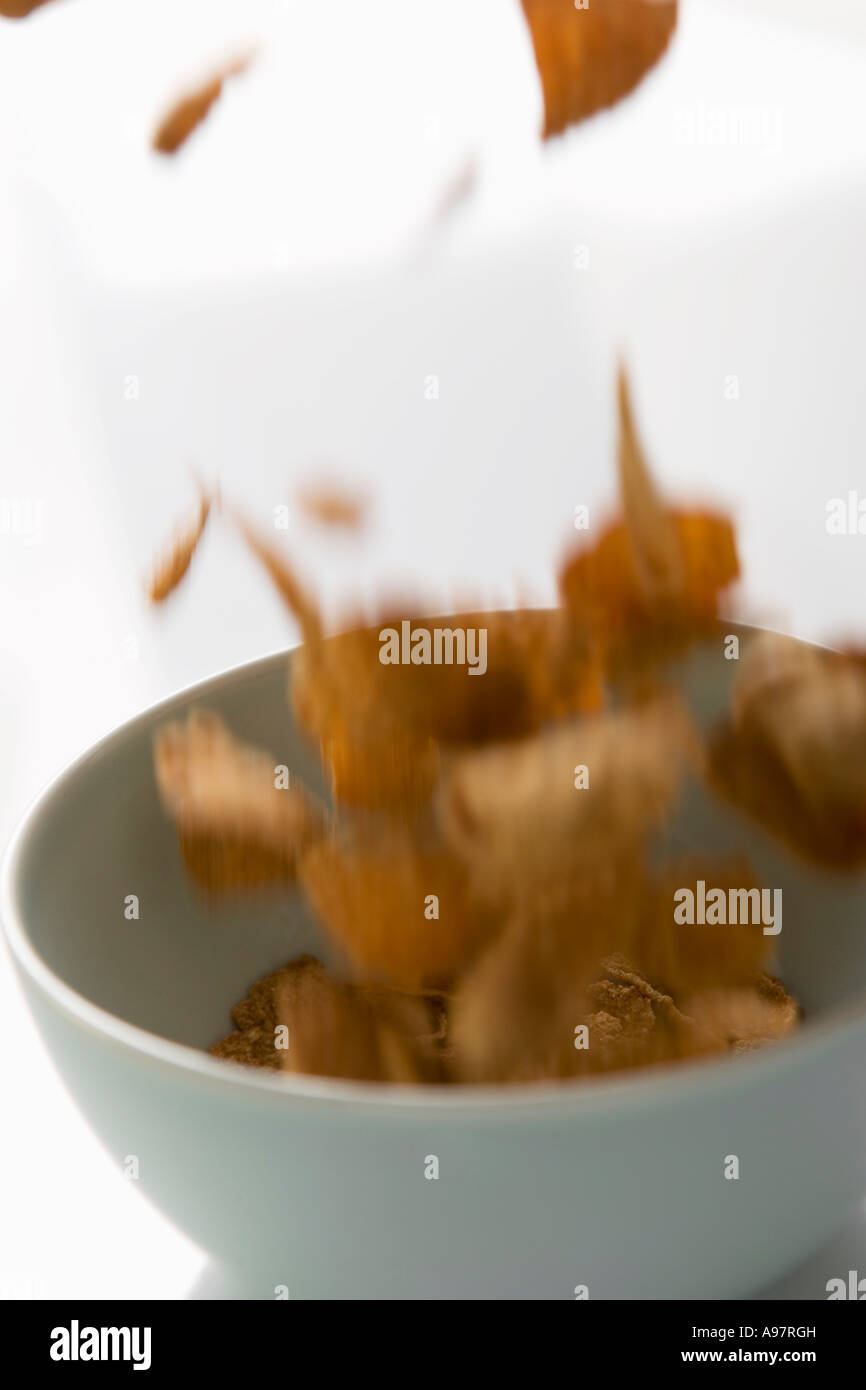 Cereal flakes falling into a cereal bowl FoodCollection Stock Photo - Alamy