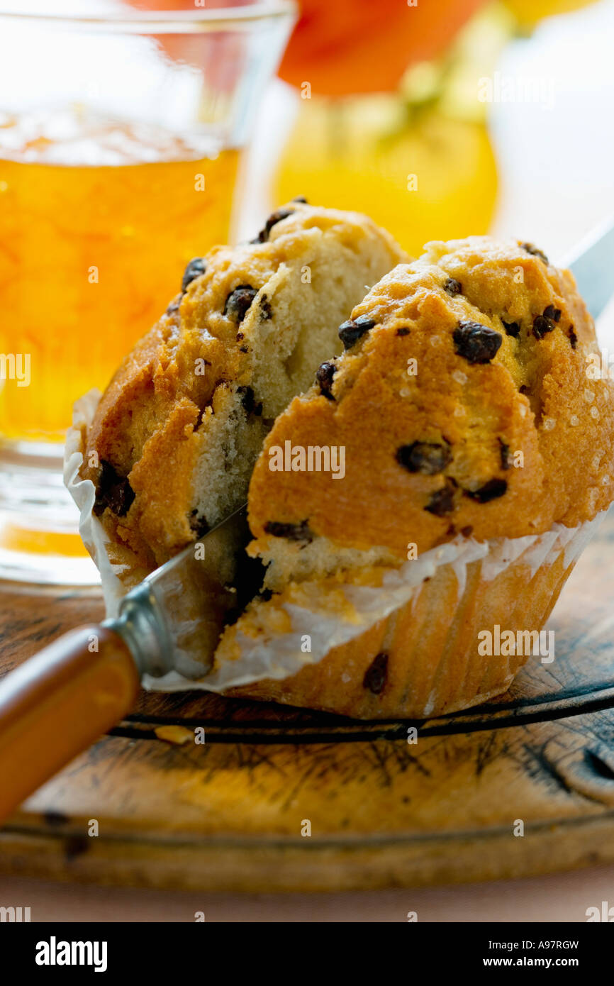 Cutting a chocolate chip muffin in half FoodCollection Stock Photo - Alamy