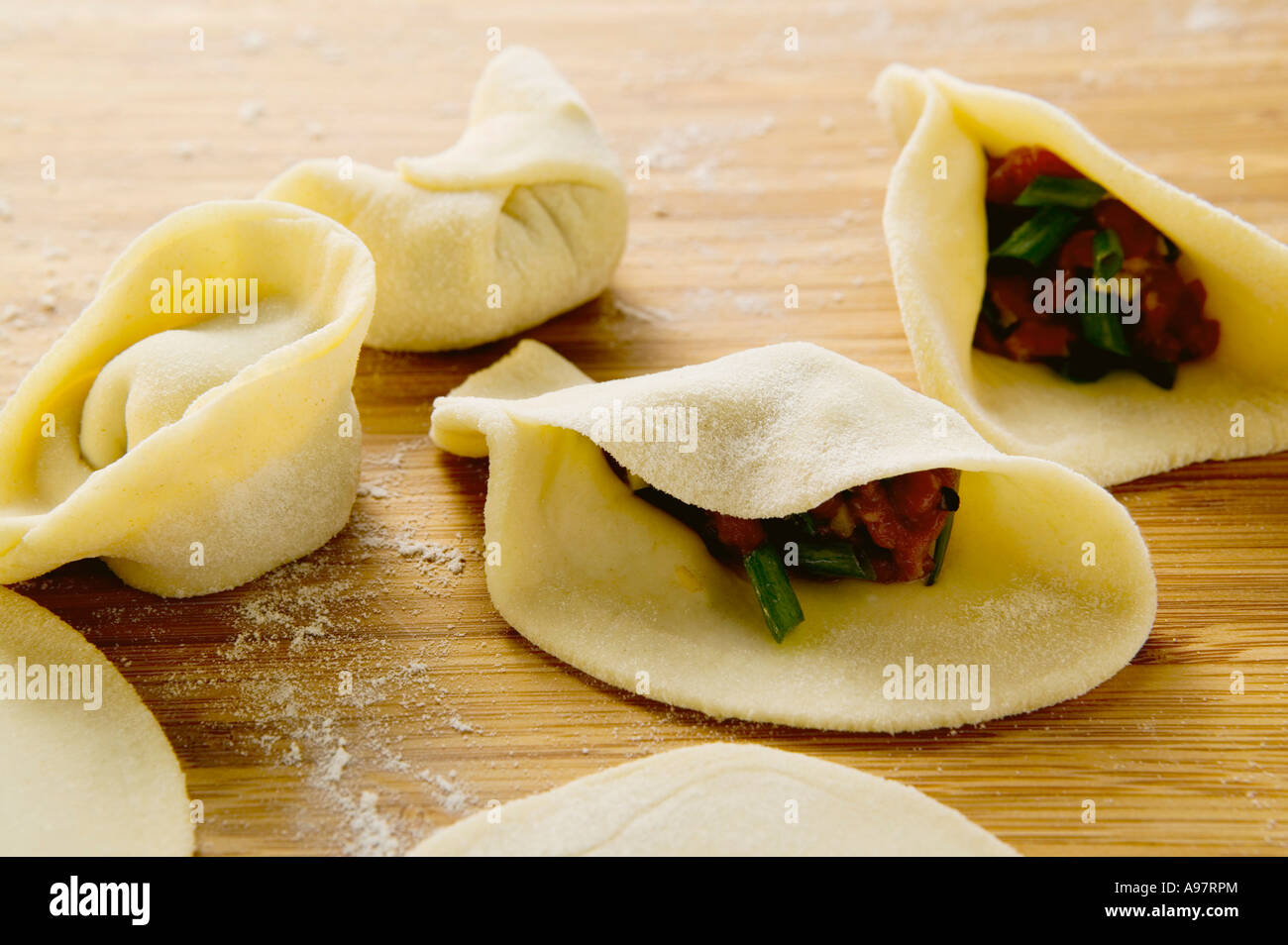Making pasta parcels with loin of beef China FoodCollection Stock Photo ...