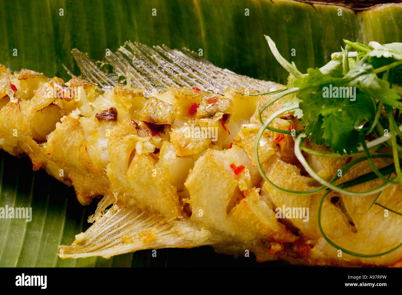 Fried zander on banana leaf Indonesia FoodCollection Stock Photo - Alamy