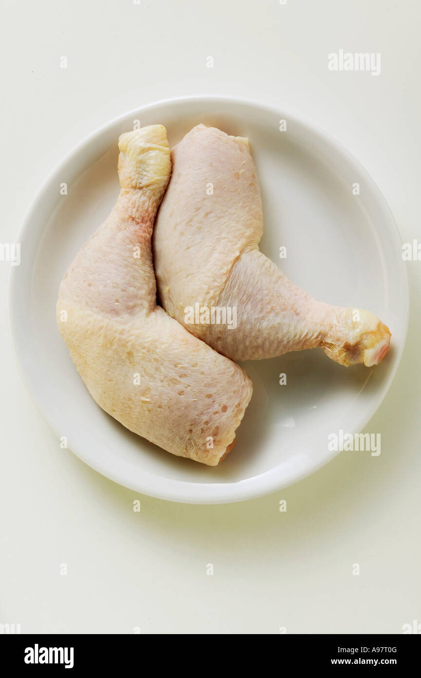 Two chicken legs on plate FoodCollection Stock Photo - Alamy