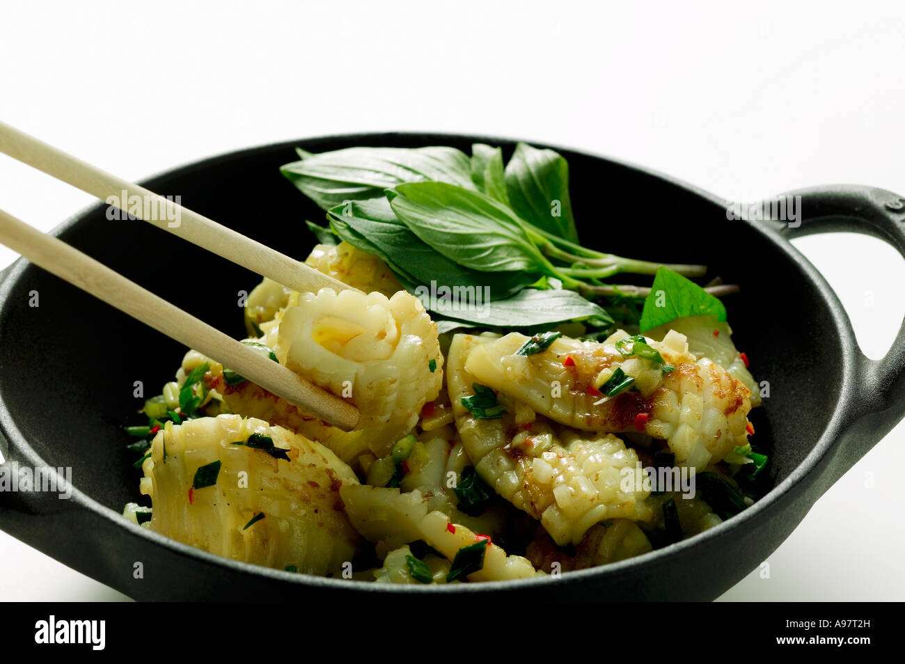Spicy squid with Thai basil cooked in the wok FoodCollection Stock ...