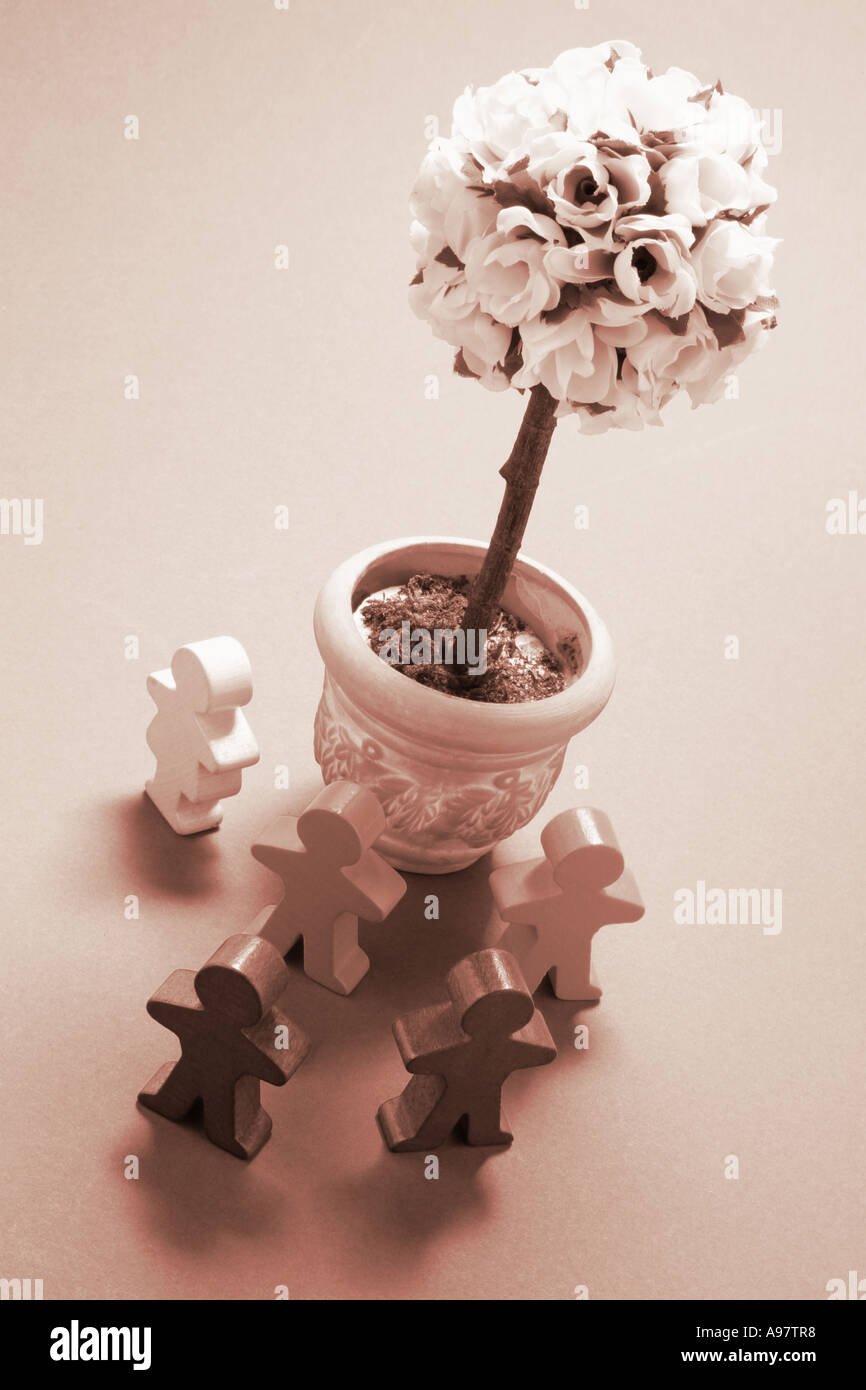 Wooden Children Figures and Artificial Pot Plant Stock Photo - Alamy