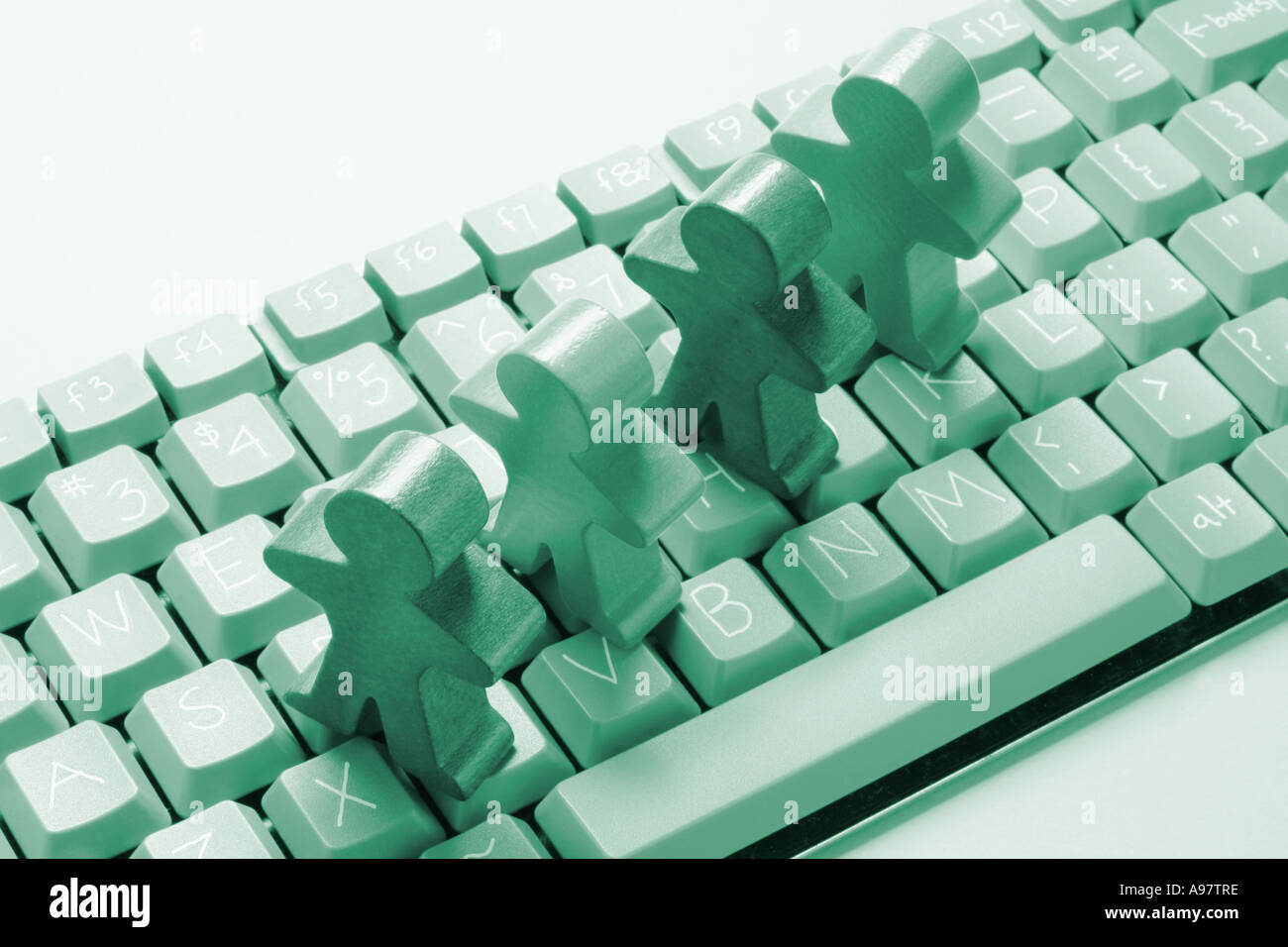 Wooden Children Figures on Computer Keyboard Stock Photo - Alamy