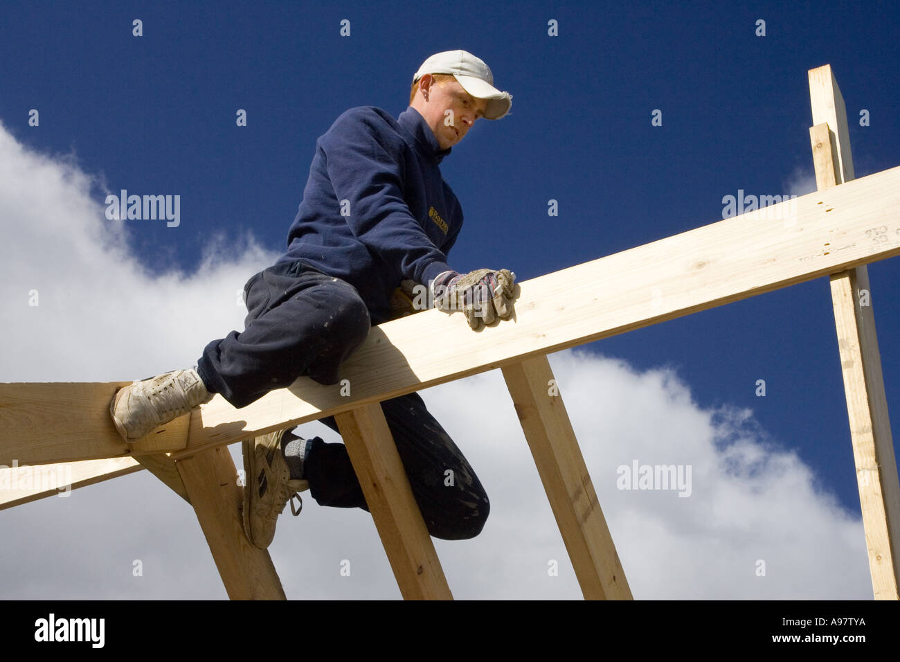 builders contructing a new roof for an extension to a home Stock Photo ...