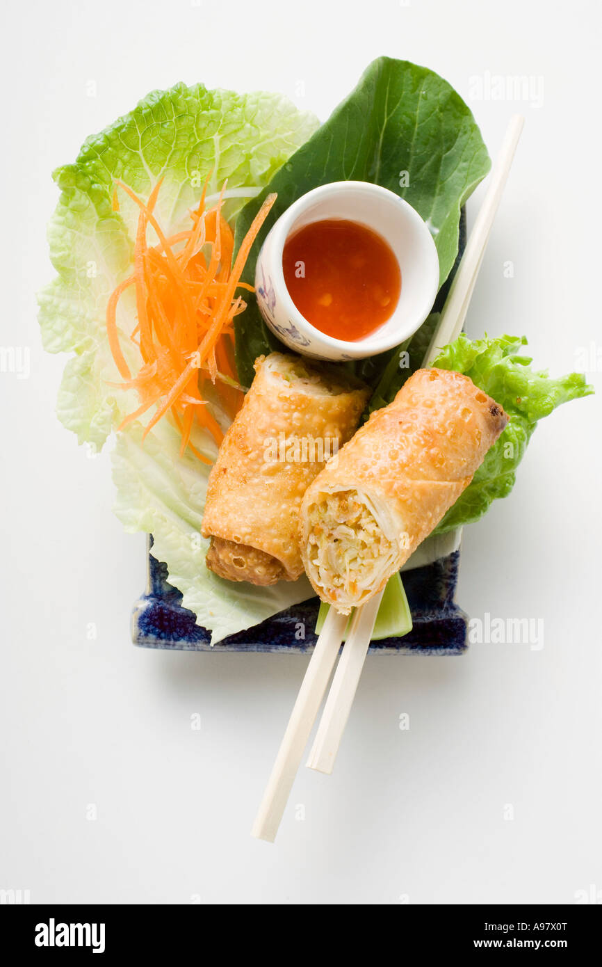 Spring roll cut in half on salad China FoodCollection Stock Photo - Alamy
