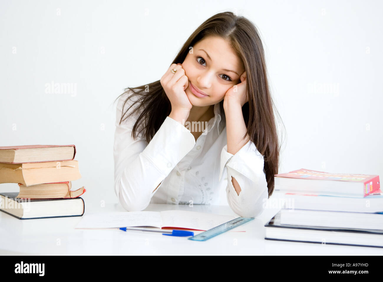 Young pretty girl fed up studying for exams Stock Photo - Alamy