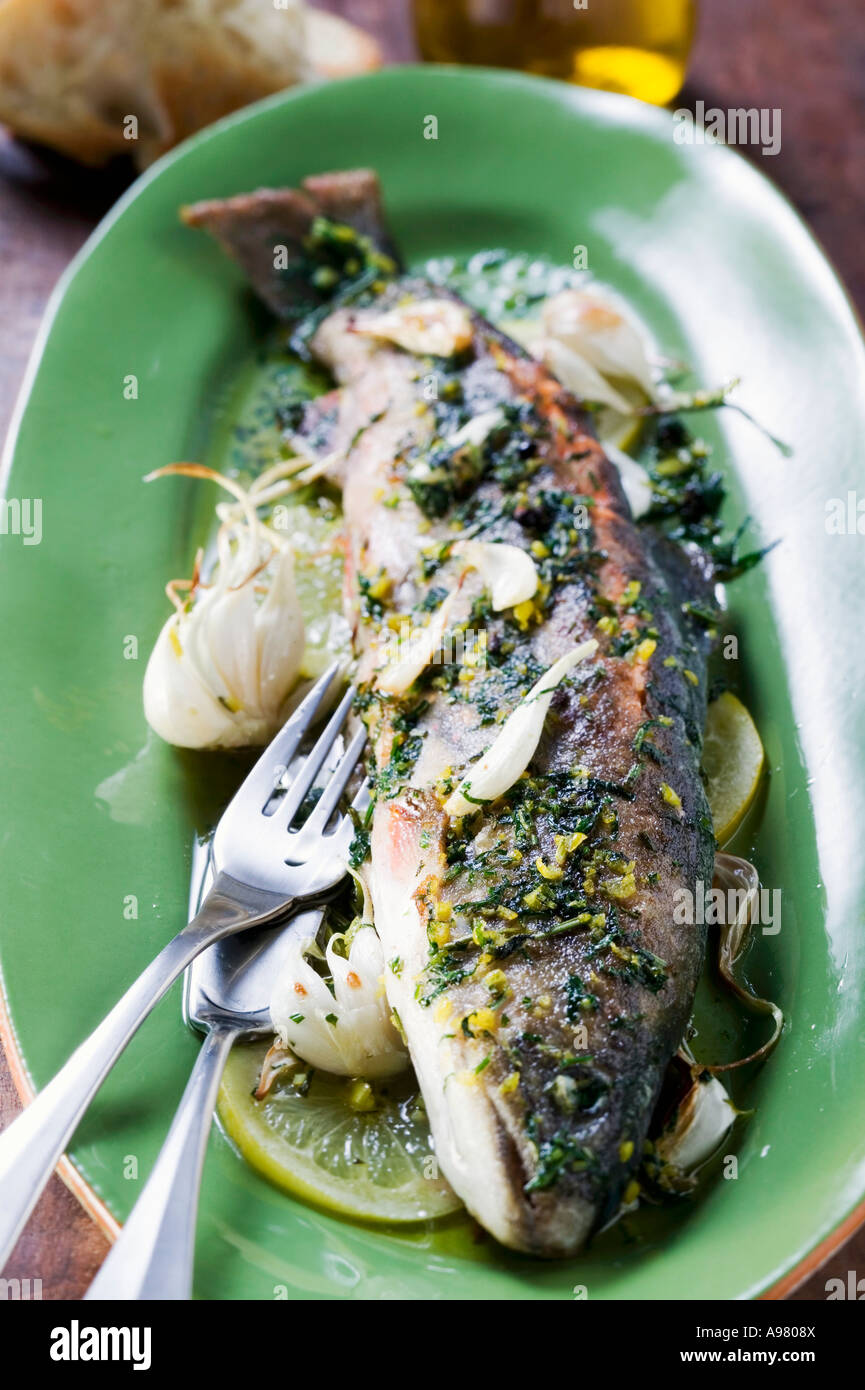 Fish with garlic lemon and herbs FoodCollection Stock Photo - Alamy