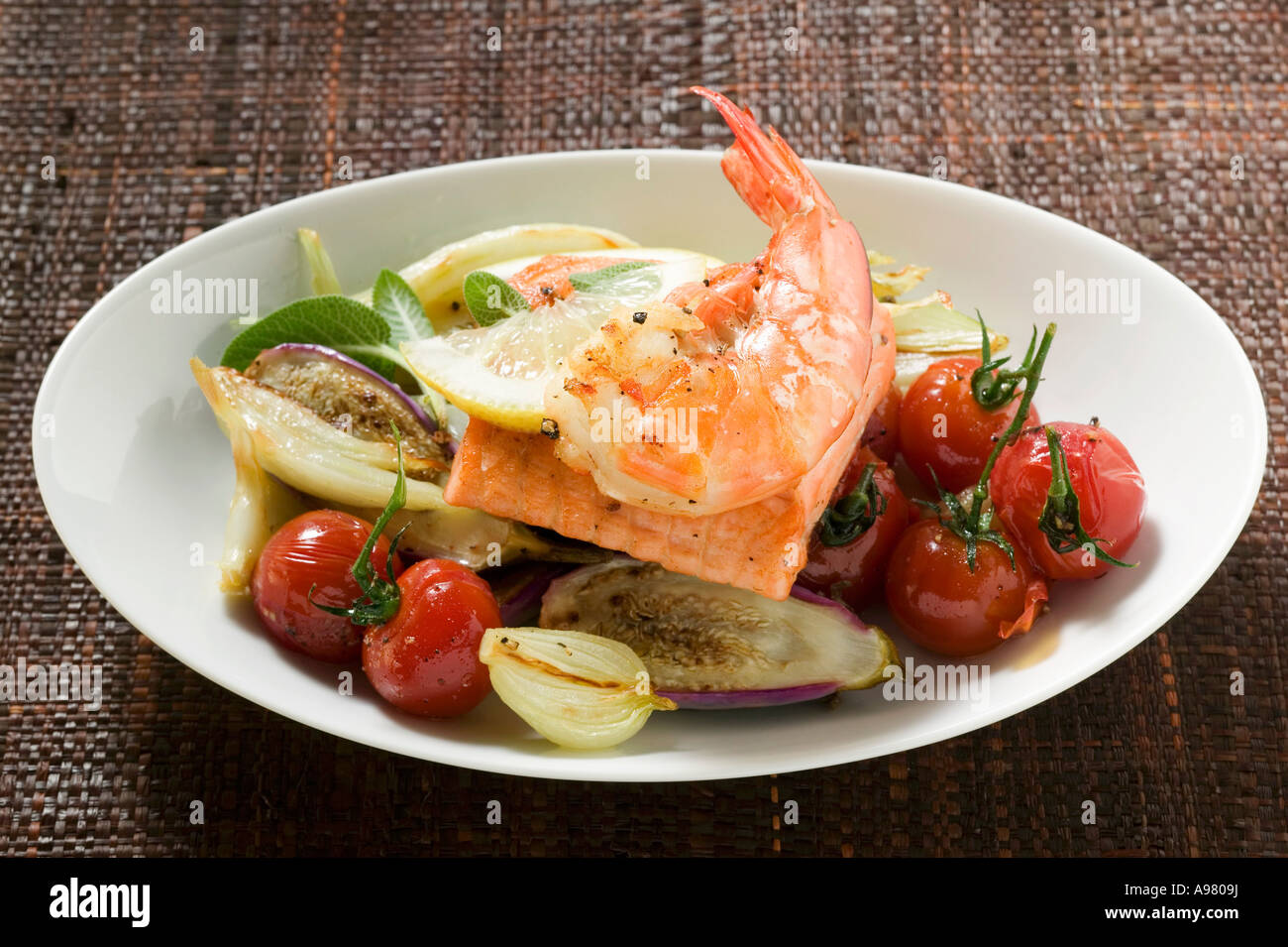 Shrimp on salmon fillet with vegetables FoodCollection Stock Photo - Alamy