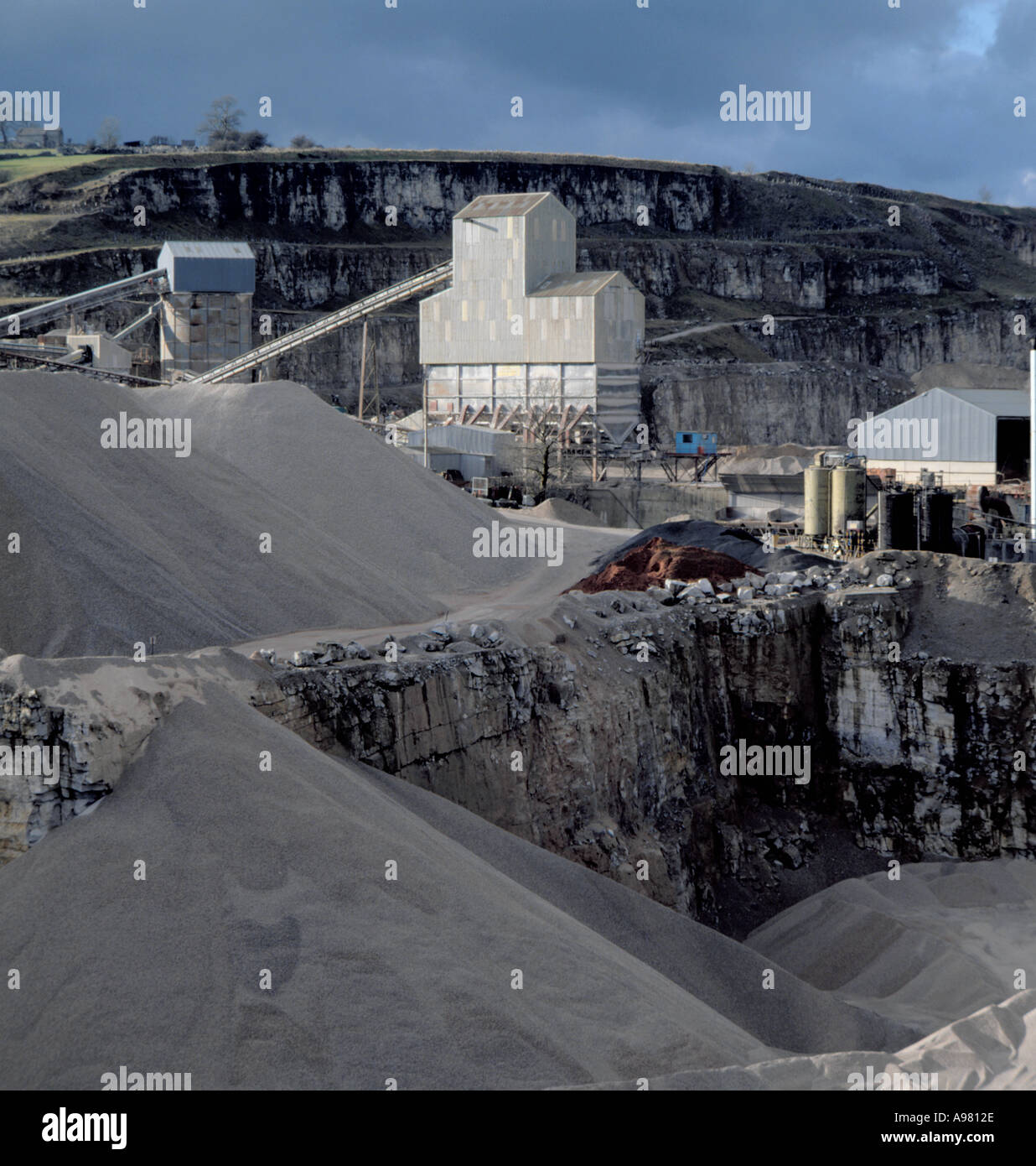 Stock piles and plant buildings in a limestone quarry, near Cromford ...