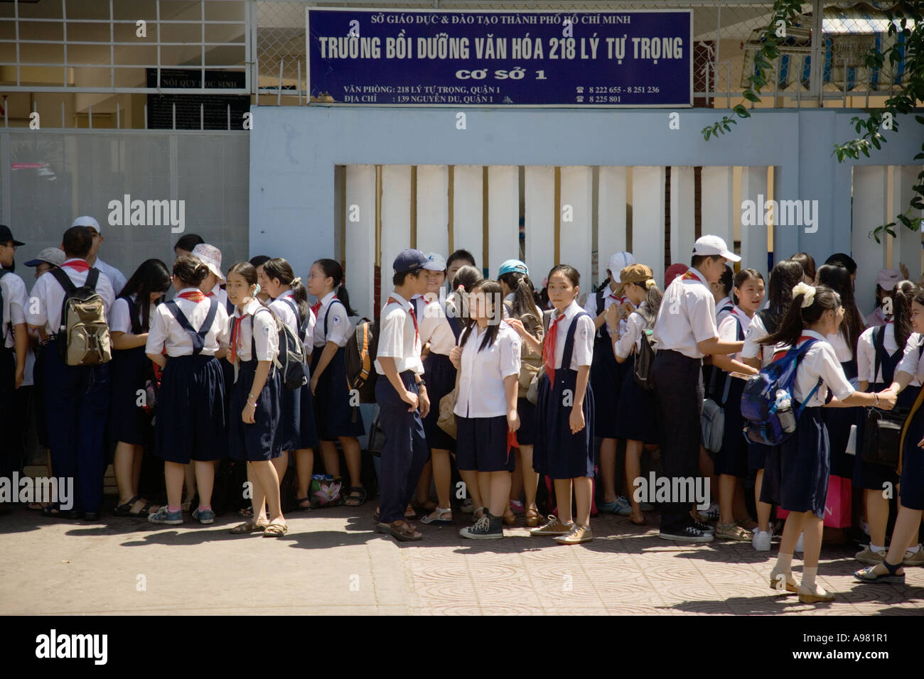 Uniformed schoolchildren wait in queue, Ho Chi Minh City (Saigon ...