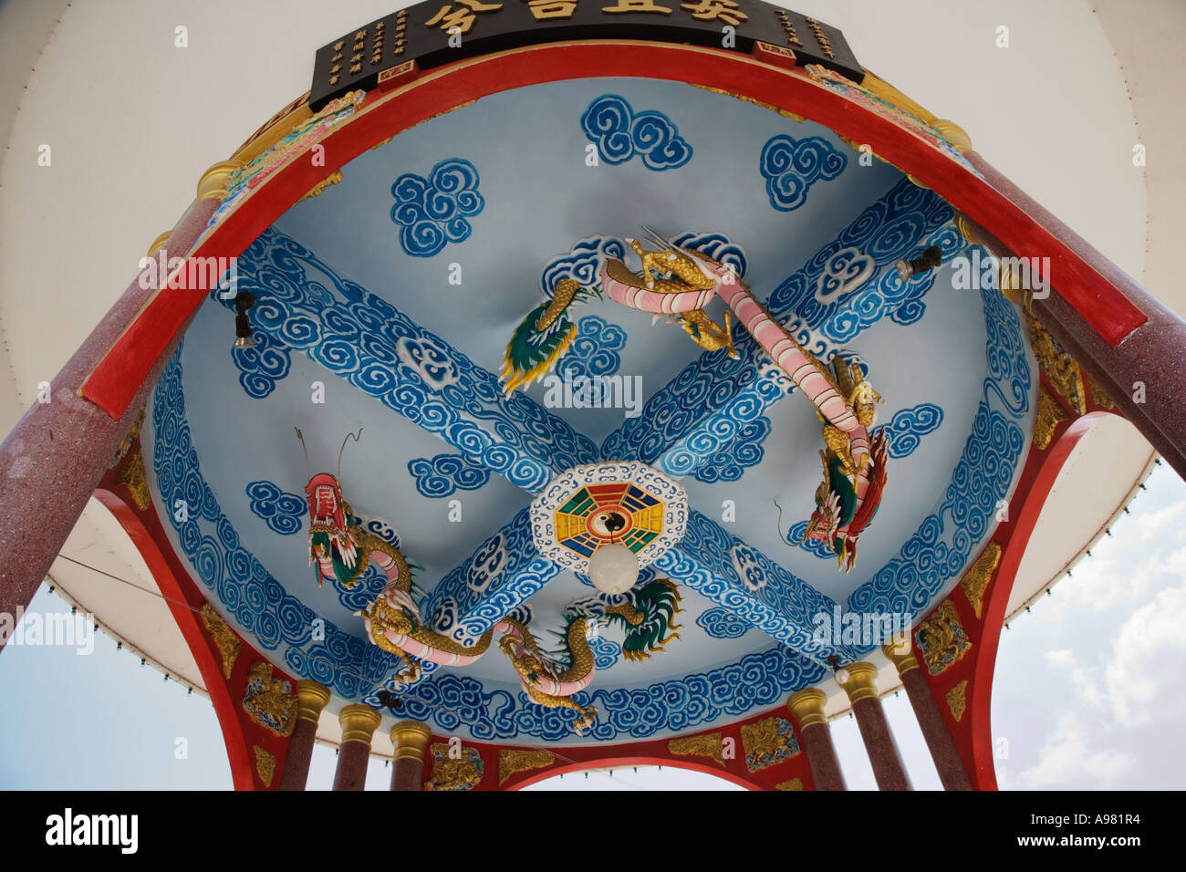 Detail of ceiling with colorful dragons, modern Thai Chinese shrine ...