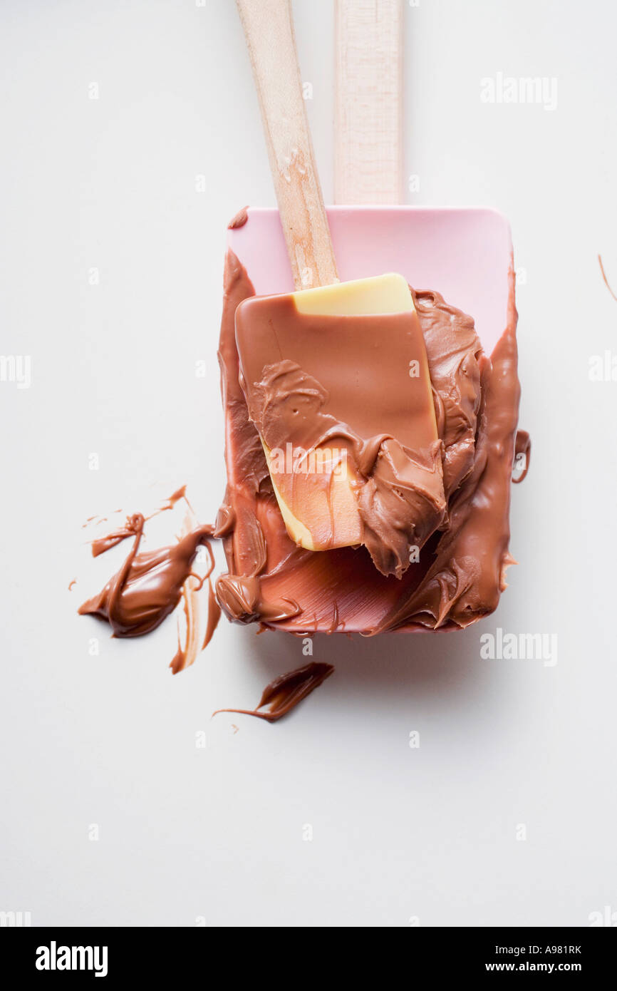 Mixing spoon with melted chocolate FoodCollection Stock Photo - Alamy