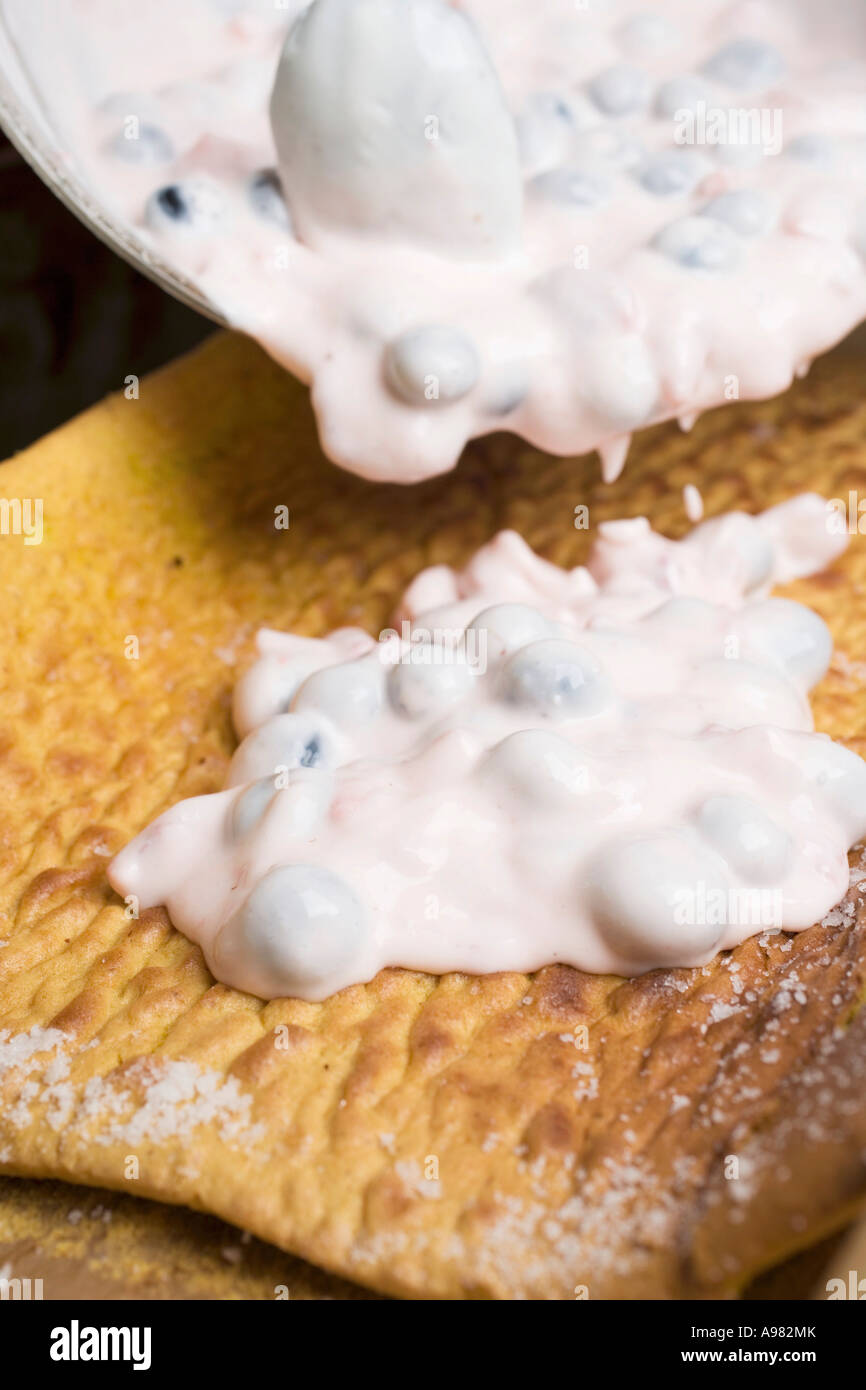 Filling a sponge roulade FoodCollection Stock Photo - Alamy