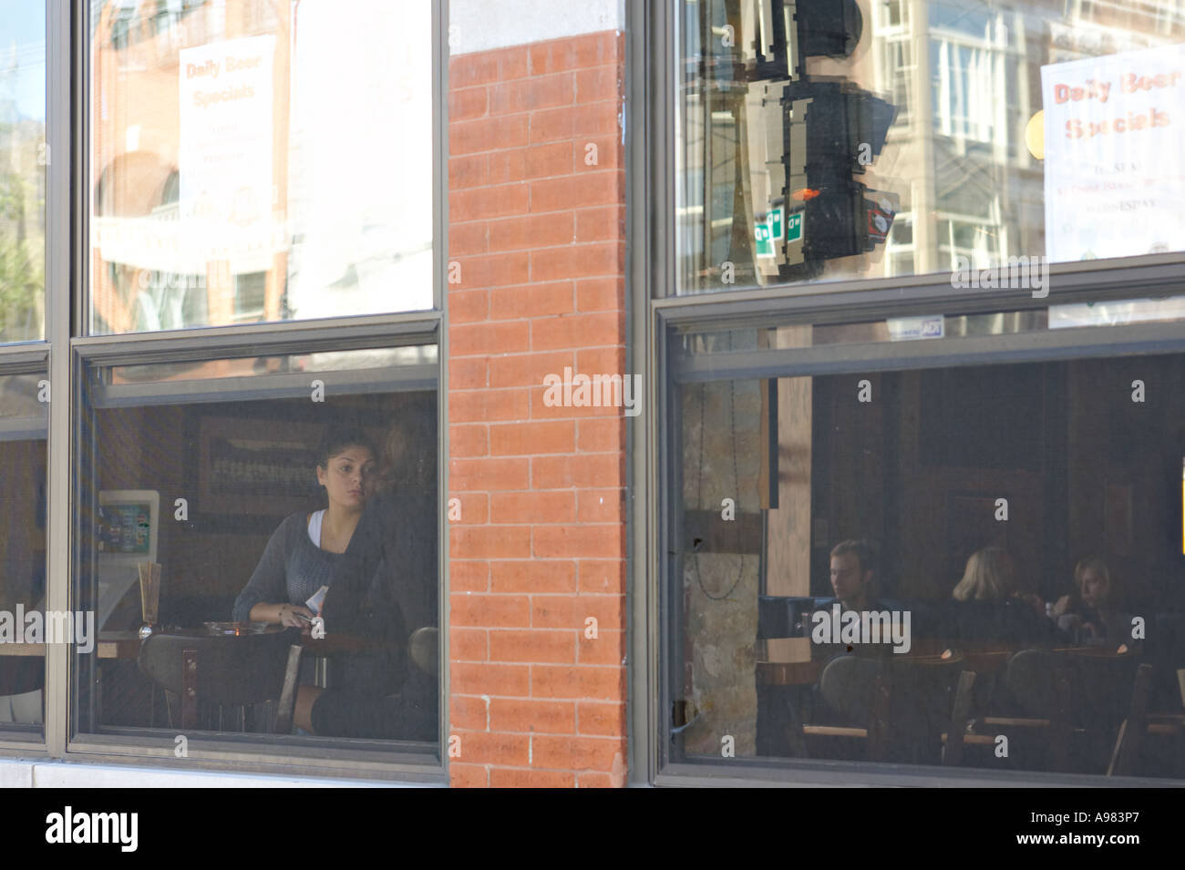 ILLINOIS Chicago Female waitress seen through window bar on Division ...