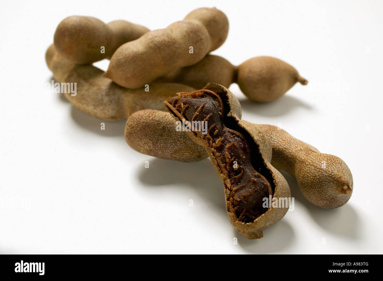 Several tamarinds one opened FoodCollection Stock Photo - Alamy